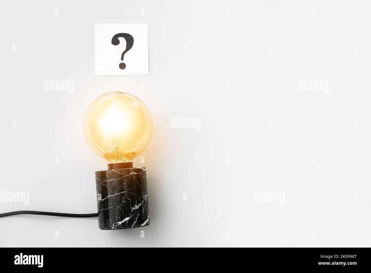 Glowing light bulb and question mark on white background. Concept of ...