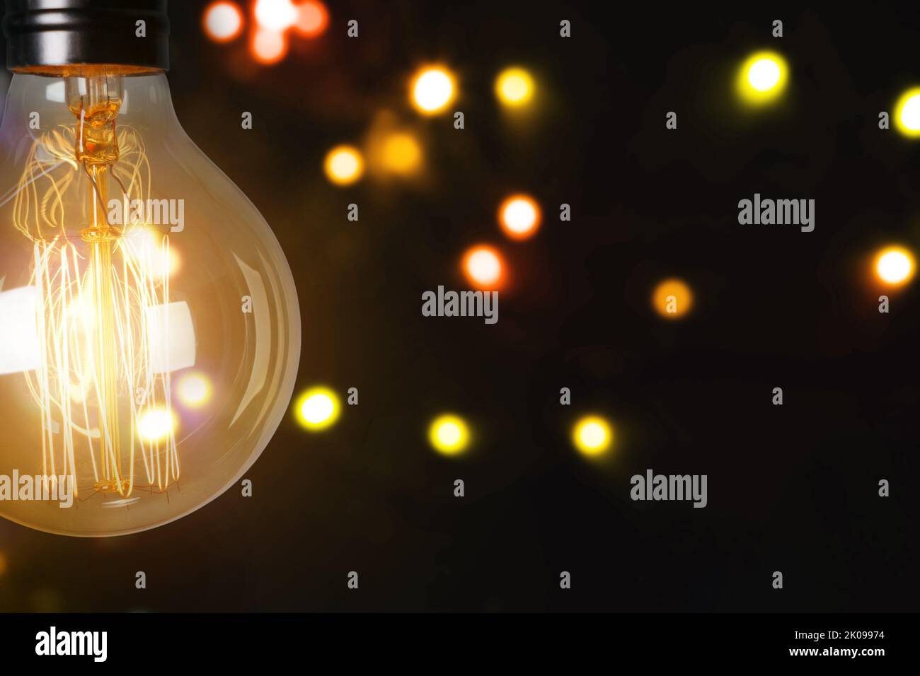 Glowing light bulb on dark background, closeup Stock Photo - Alamy