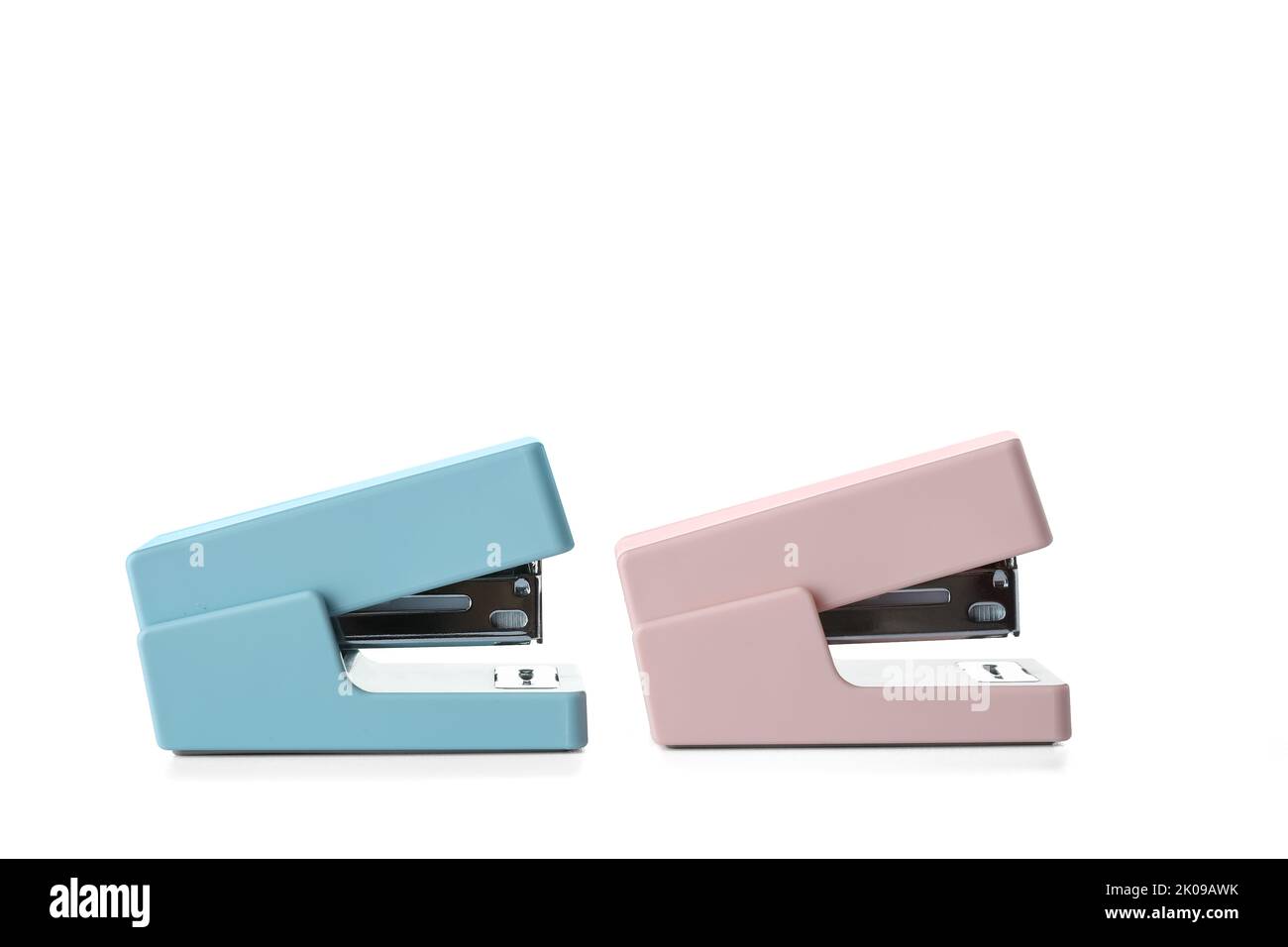 Two staplers on white background Stock Photo - Alamy