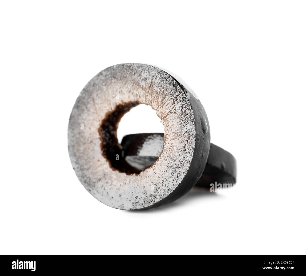 Slices of cut fresh black olives on white background Stock Photo - Alamy