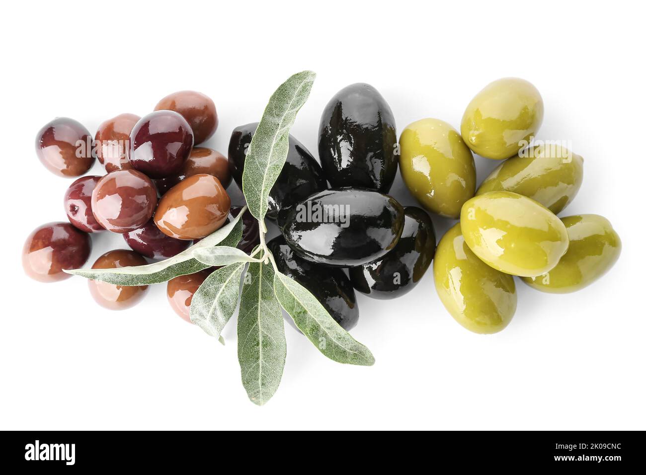 Different kinds of tasty olives on white background Stock Photo - Alamy