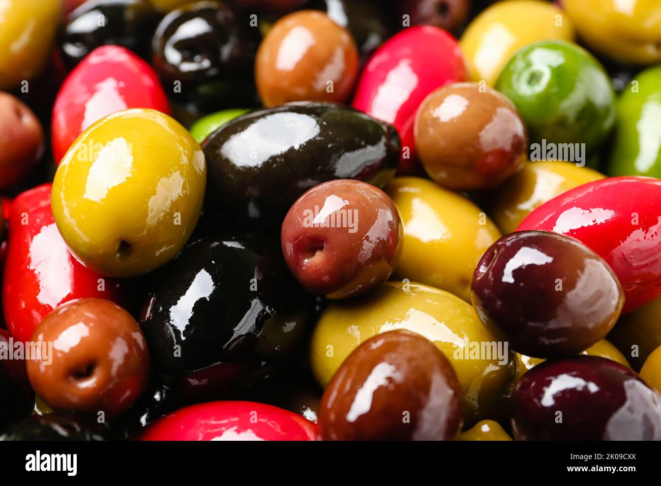 Different kinds of tasty olives as background, closeup Stock Photo - Alamy