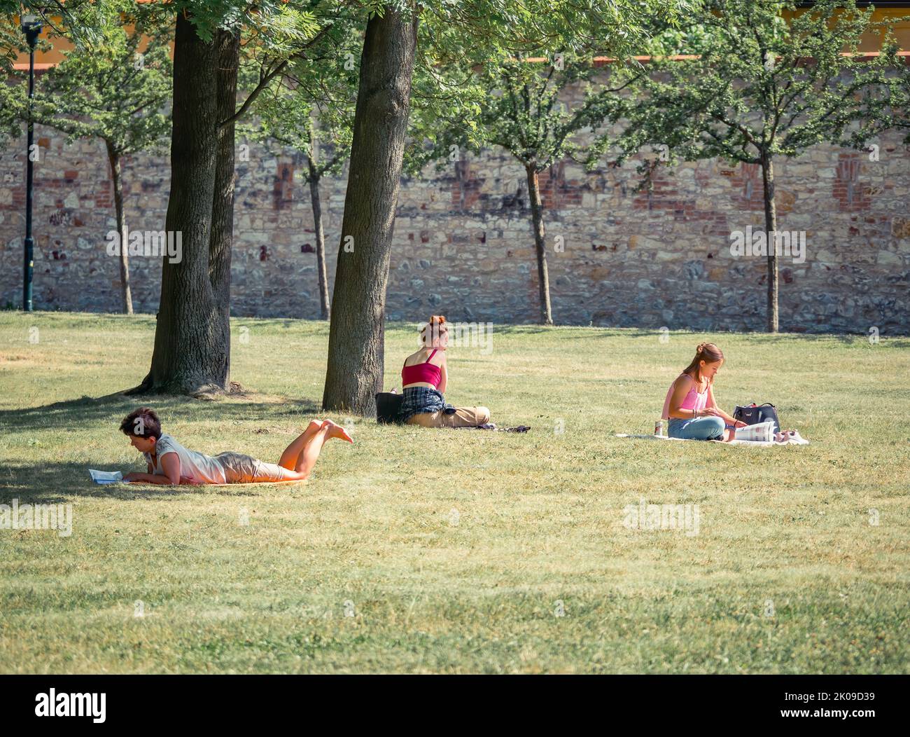 Prague, Czech Republic - June 2022: Young girls or women relaxing on ...
