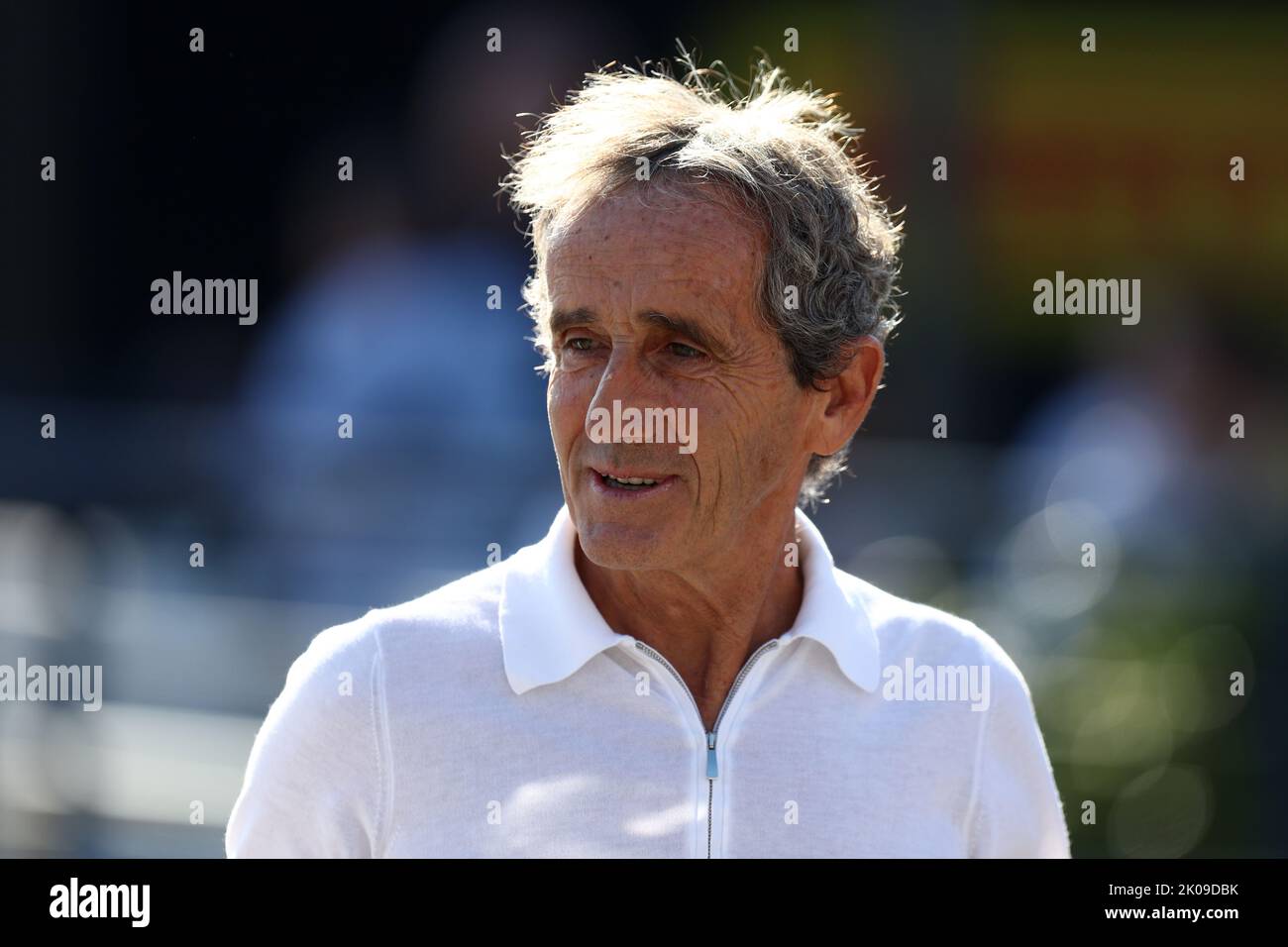 Former Driver Alain Prost looks on in the paddock before qualifying for ...