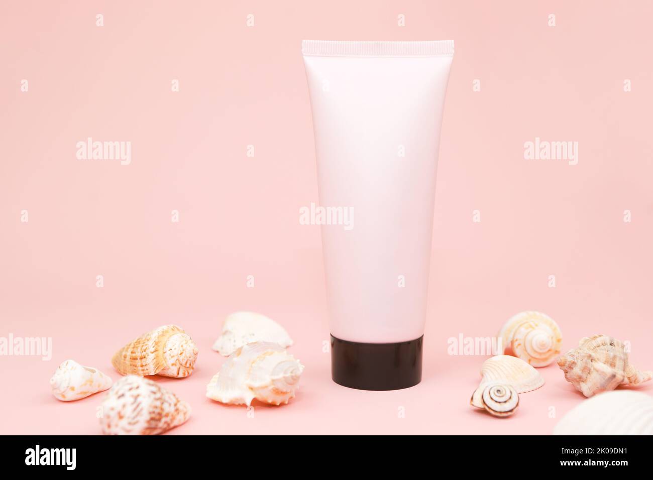 Mockup Pink squeeze bottle cosmetic tube with screw black cap and ...