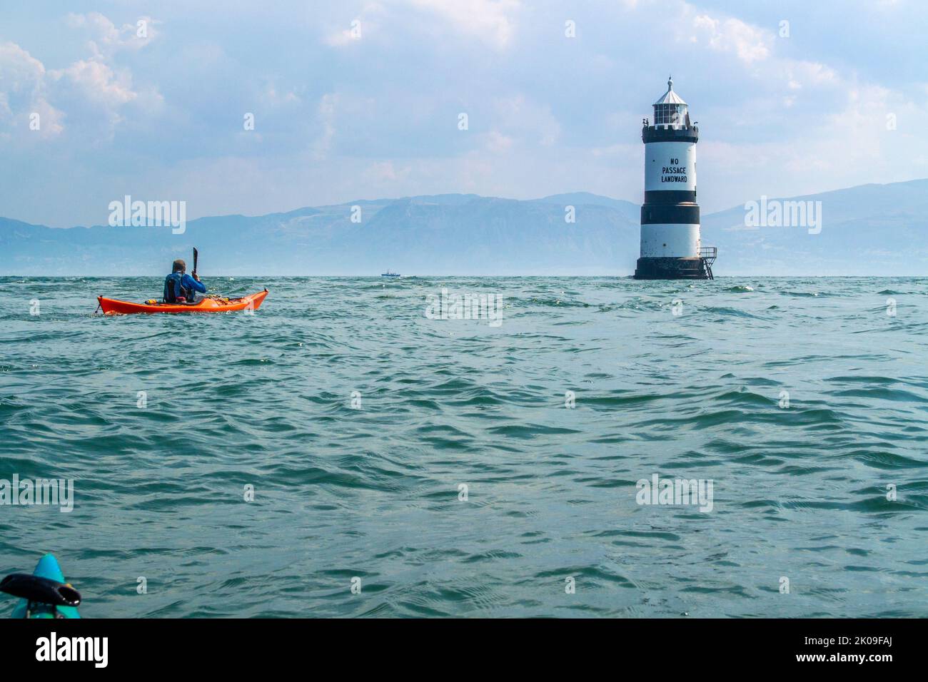 Sea kayaking near Trwyn Du Lighthouse, also known as Penmon Lighthouse ...