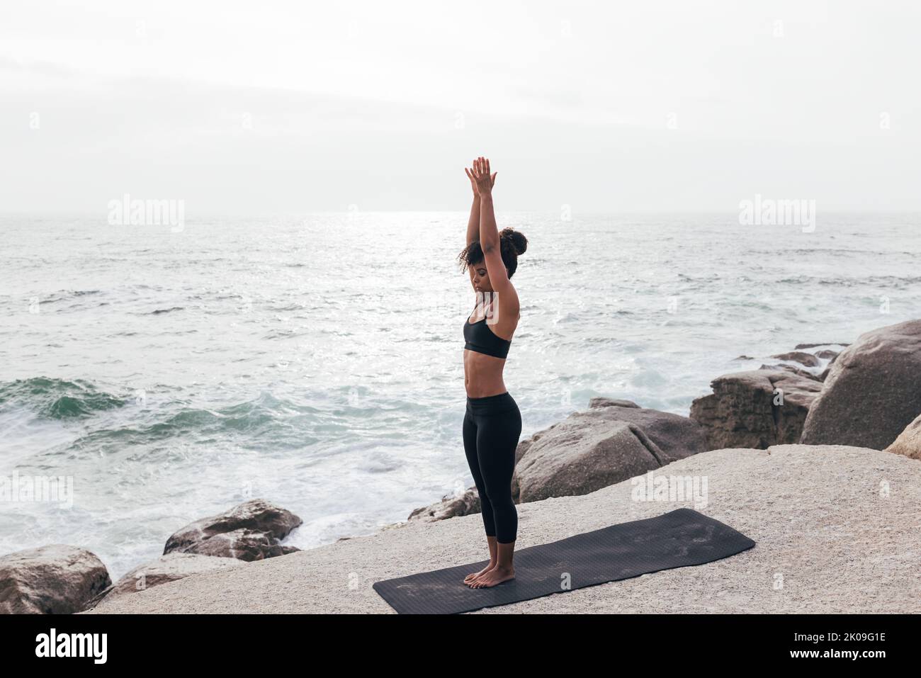 Woman practicing Upward Hand Pose. Slim female in fitness wear doing ...