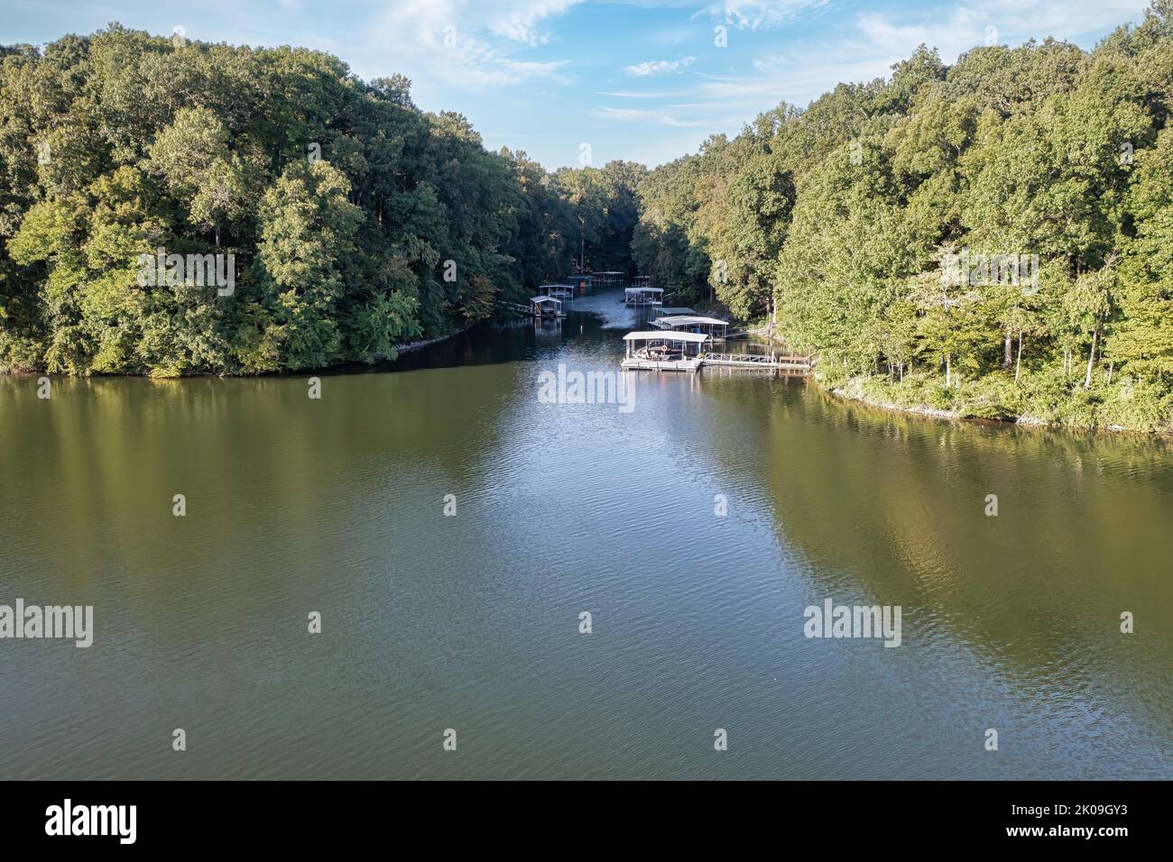 Aerial shot of floating boat docks in a small lake cove on Time Ford ...