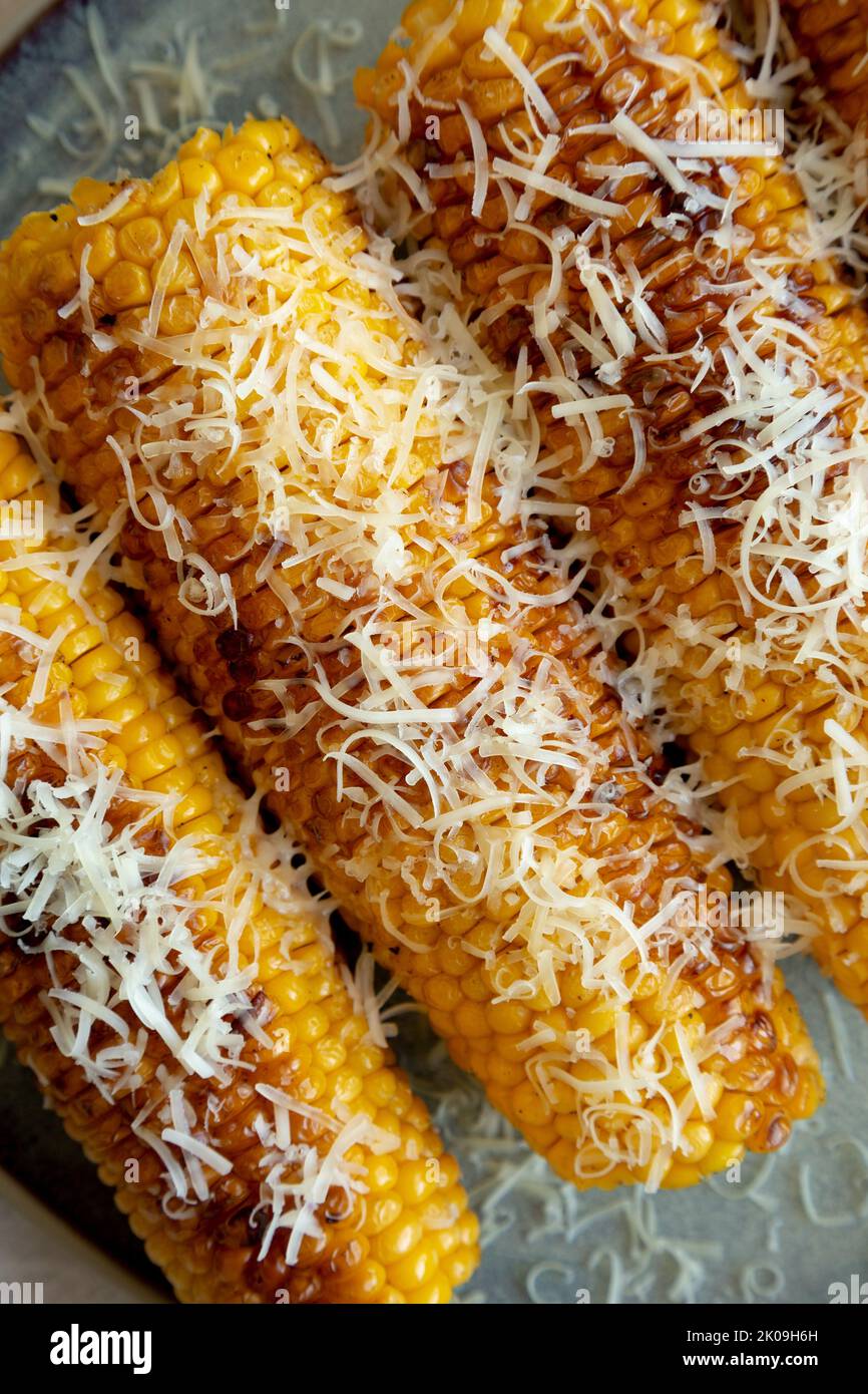 Homemade Garlic Parmesan Grilled Corn on a Plate, top view. Flat lay ...