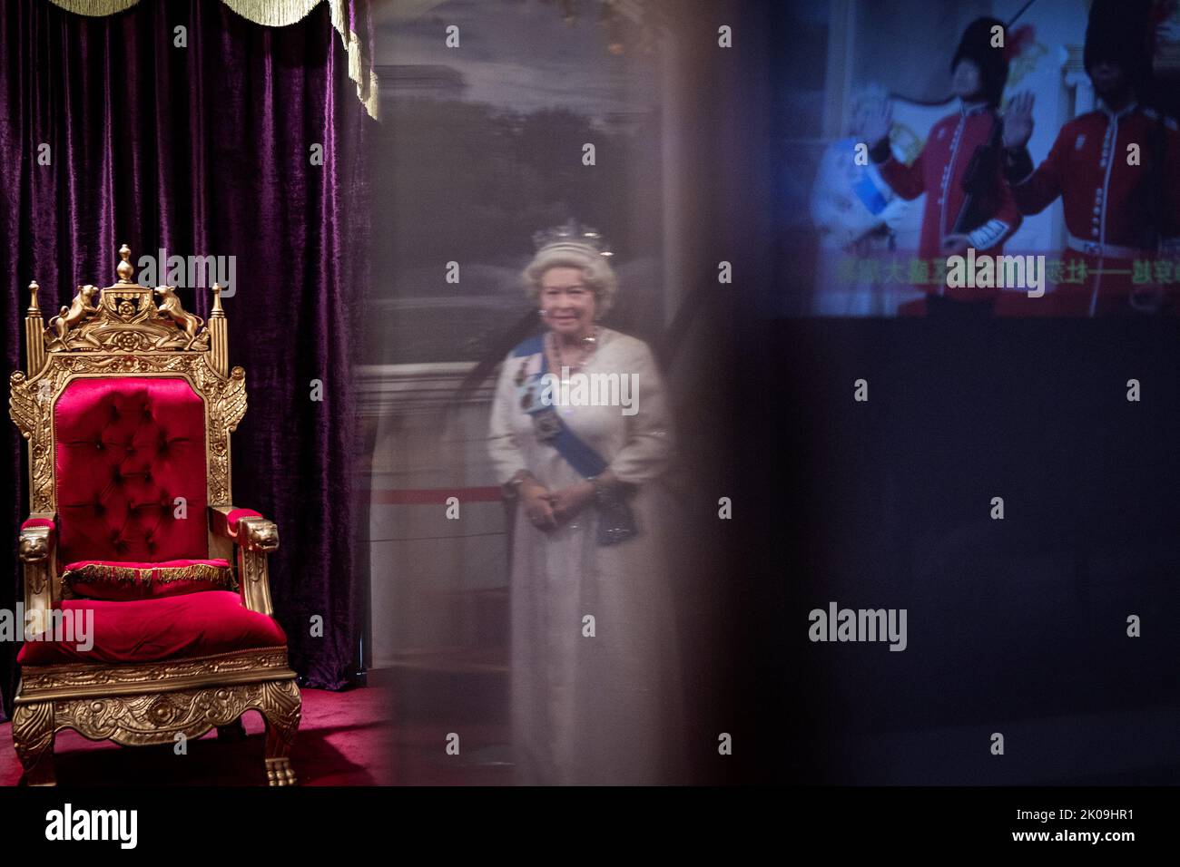 A reflection of a wax figure of the late Britain's Queen Elizabeth II ...