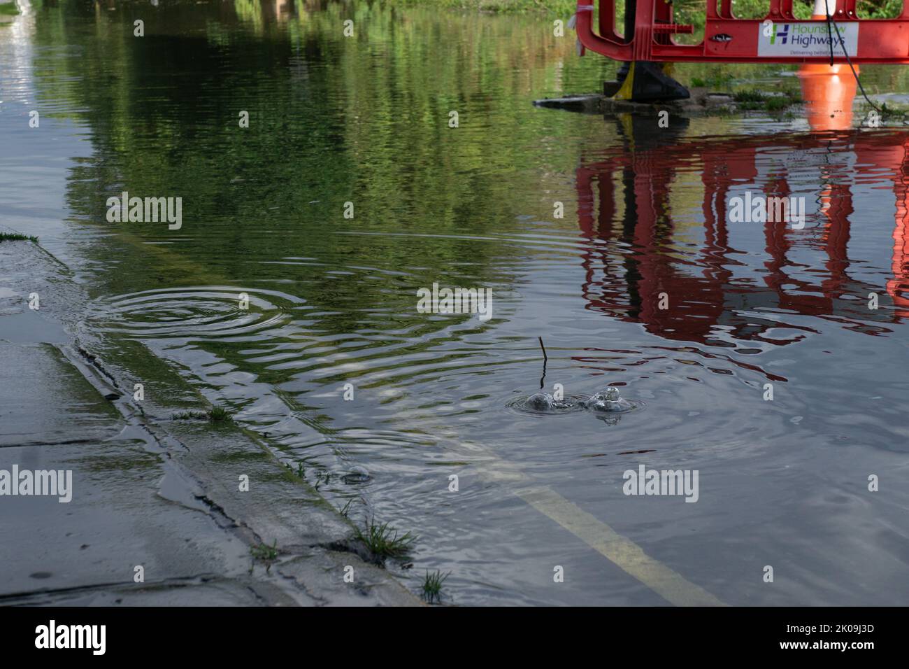 London, England, UK. 10th Sep 2022. Bubbles surfacing on a flooded road ...