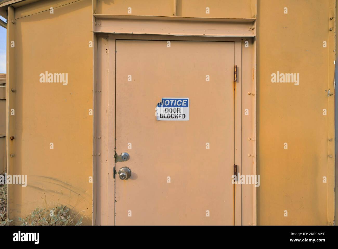 Tucson, Arizona- Notice Door Blocked signage on a cream colored door ...