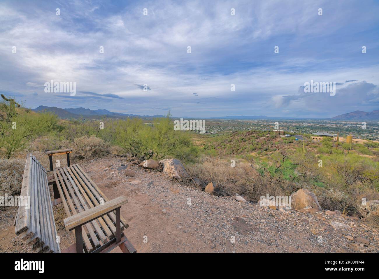 Long wooden bench with overlooking view of Tucson, Arizona landscape ...