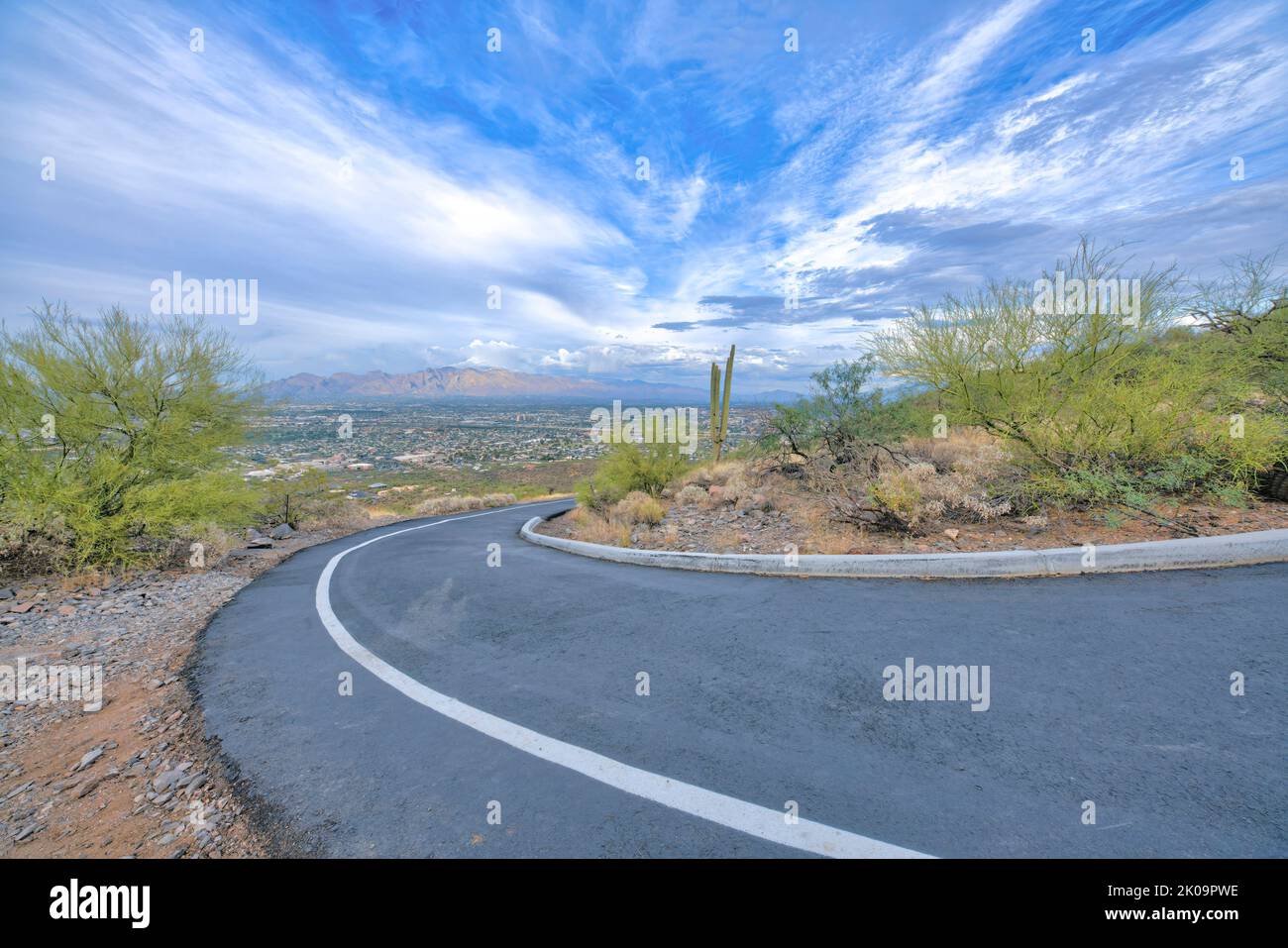 Downhill bike and walkway pathway with a view of Tucson, Arizona ...