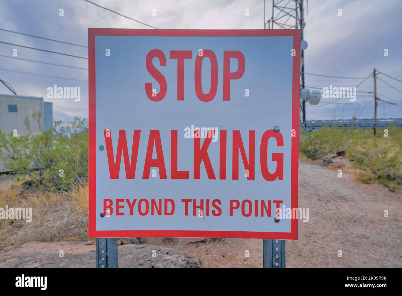 Tucson, Arizona- Stop Walking Beyond This Point signage. Close-up of a ...