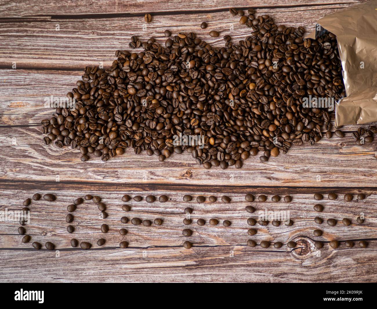 The word coffee made from coffee beans on wooden background Stock Photo ...