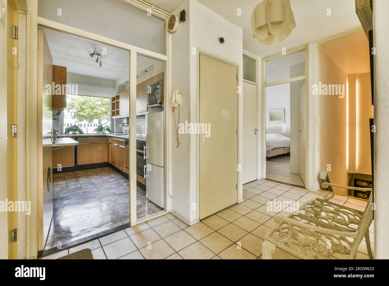 Stylish hallway with door and window to light dining room in modern ...