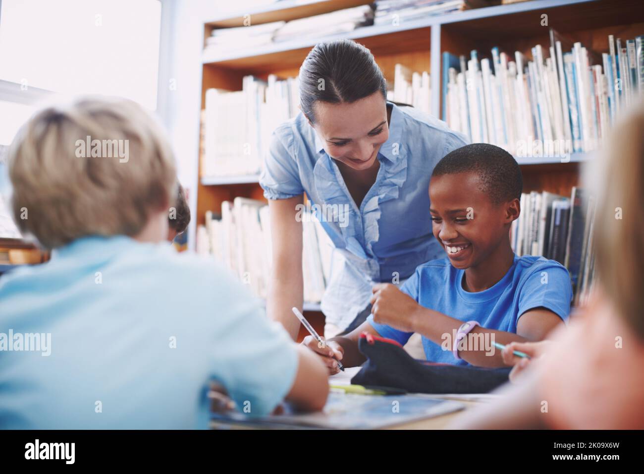 Students helping each other children hi-res stock photography and ...