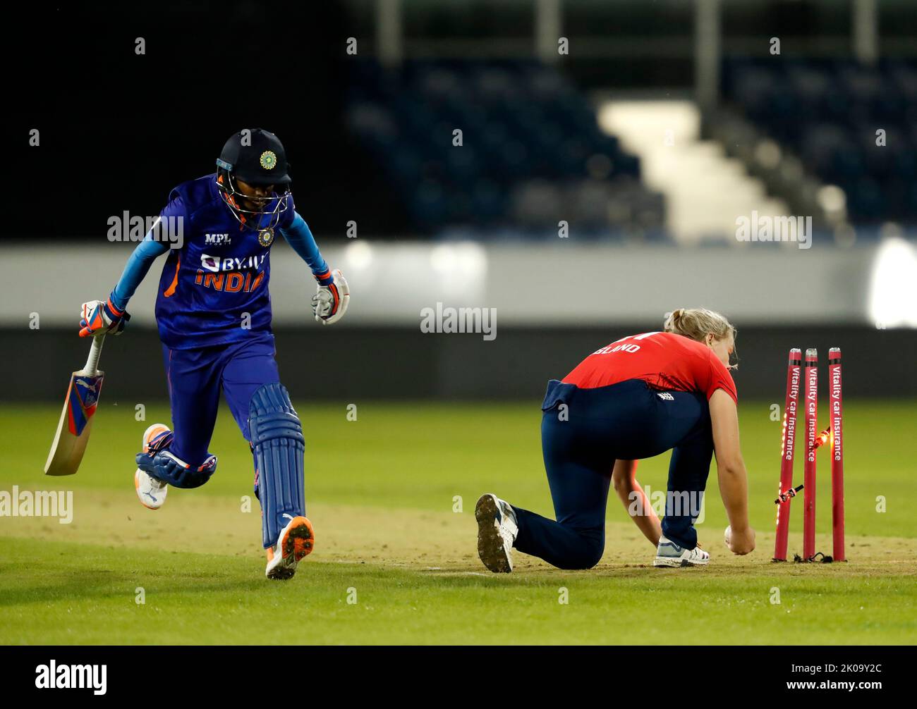 England's Freya Davies (right) runs out India's Pooja Vastrakar during ...