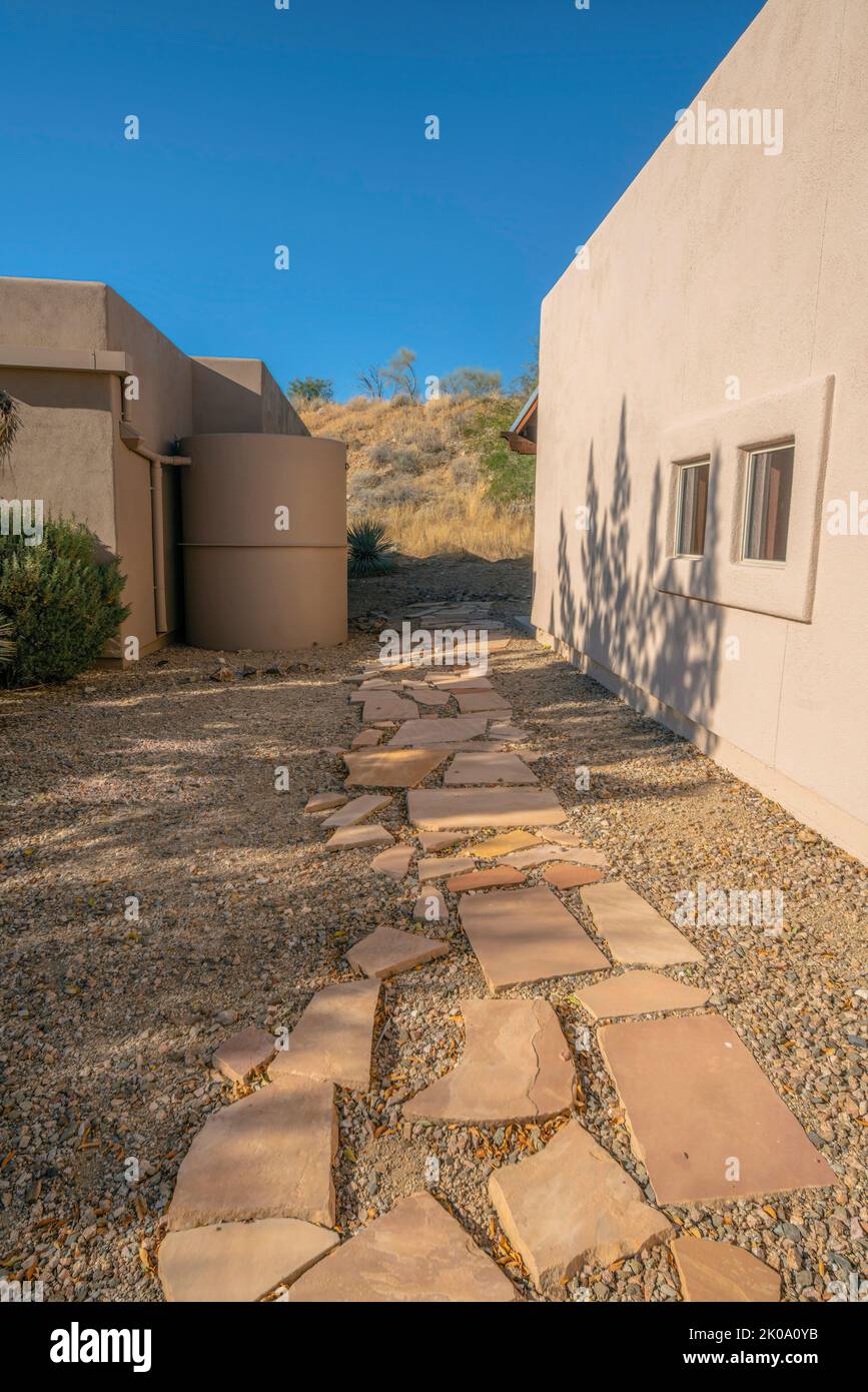Pathway with concrete pieces in the middle of two houses at Tucson ...