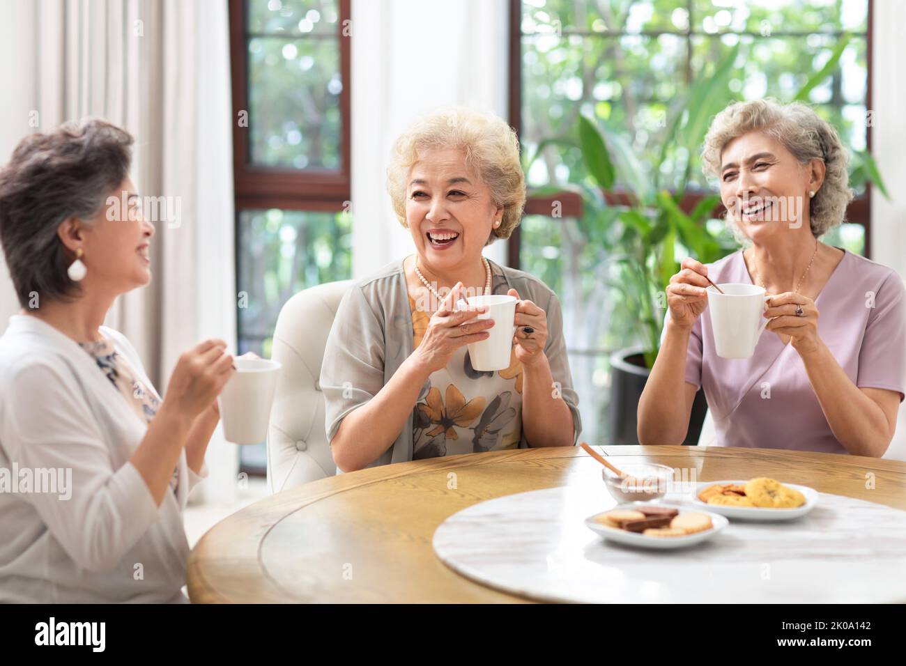 Asian friends women hot tea drinks smiling hi-res stock photography and ...