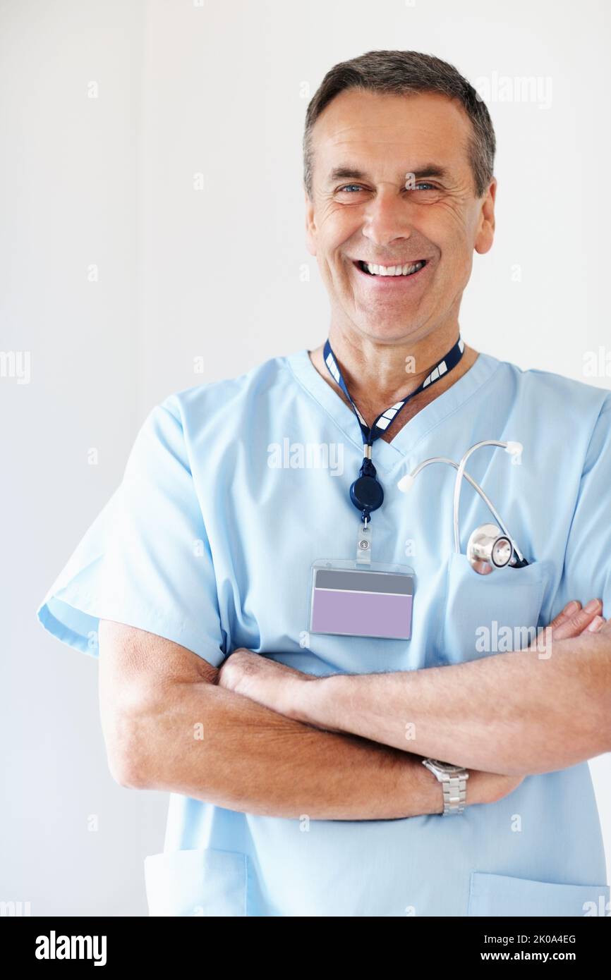 Senior doctor standing hands folded hi-res stock photography and images ...