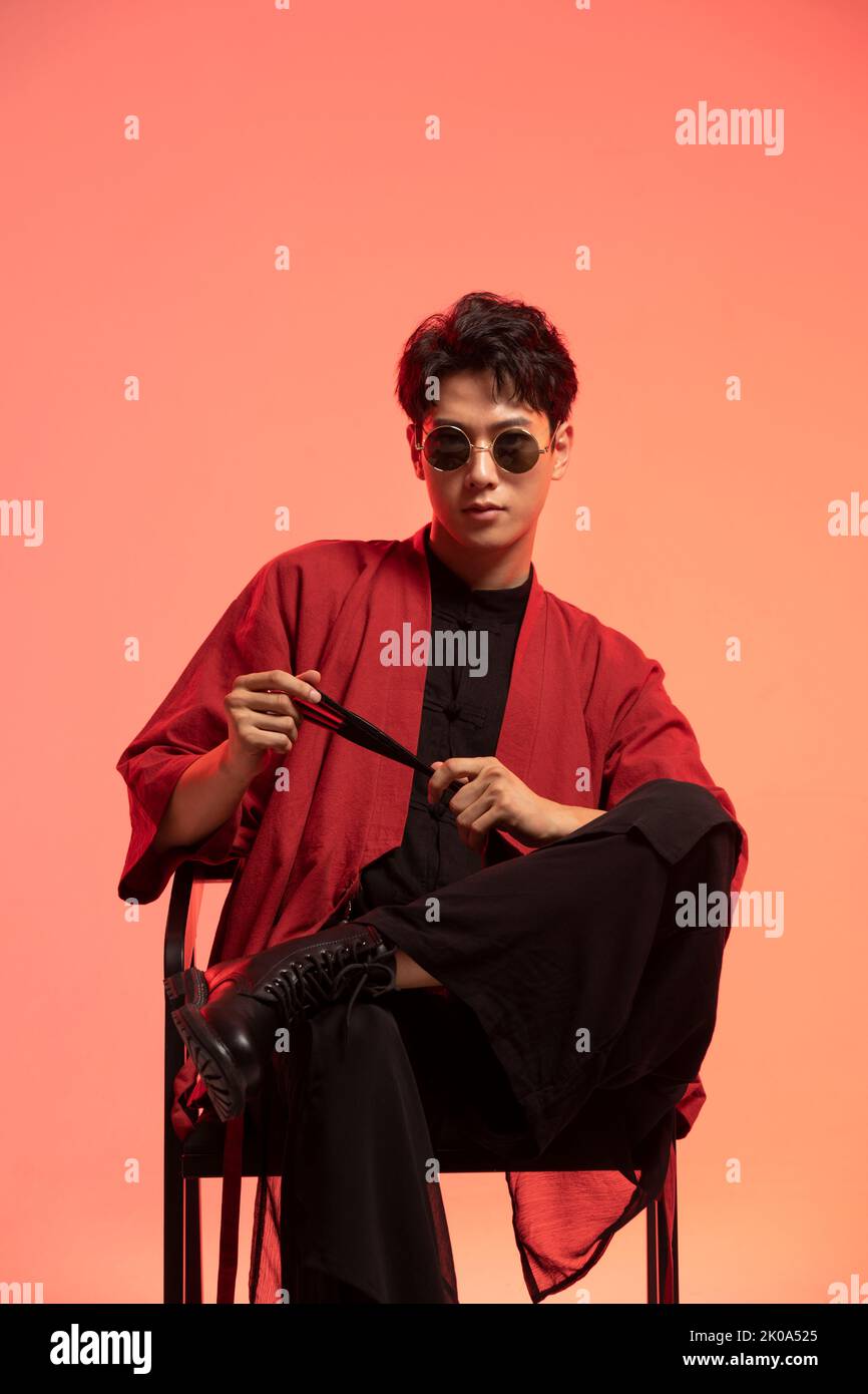 Portrait of confident young Chinese man Stock Photo - Alamy