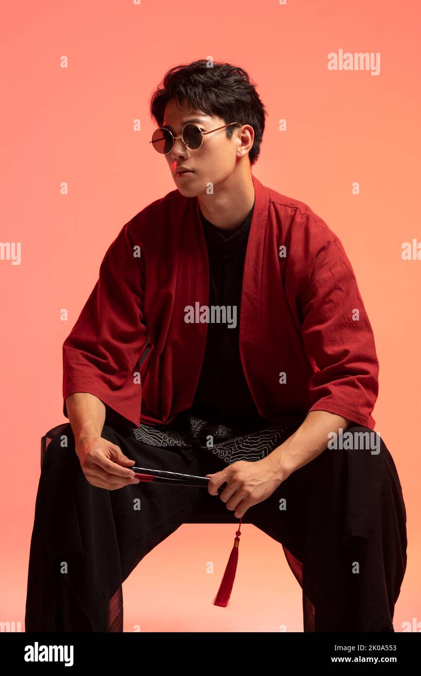 Portrait of confident young Chinese man Stock Photo - Alamy