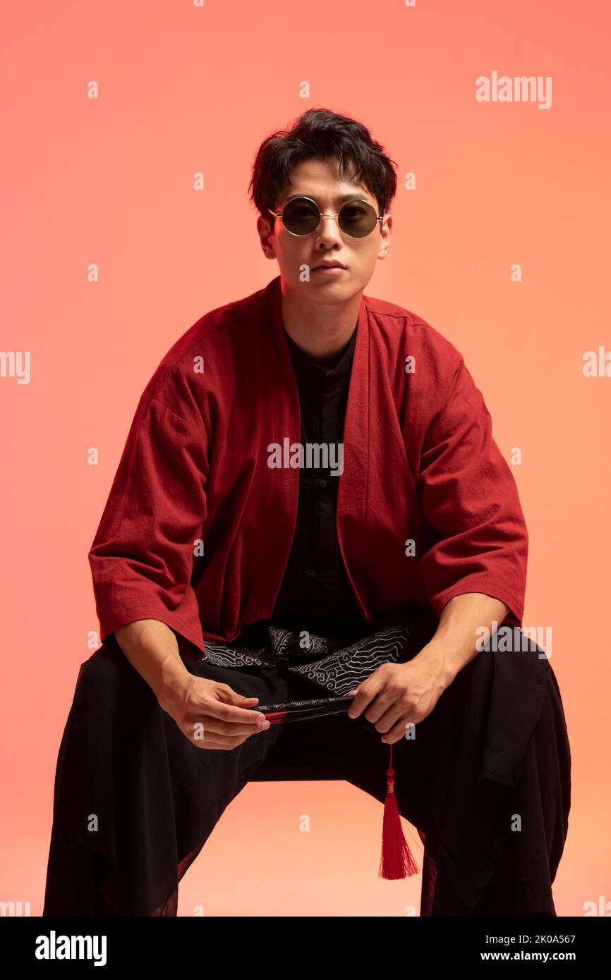 Portrait of confident young Chinese man Stock Photo - Alamy