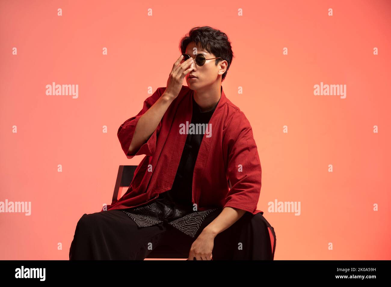 Studio shot of confident young Chinese man Stock Photo - Alamy