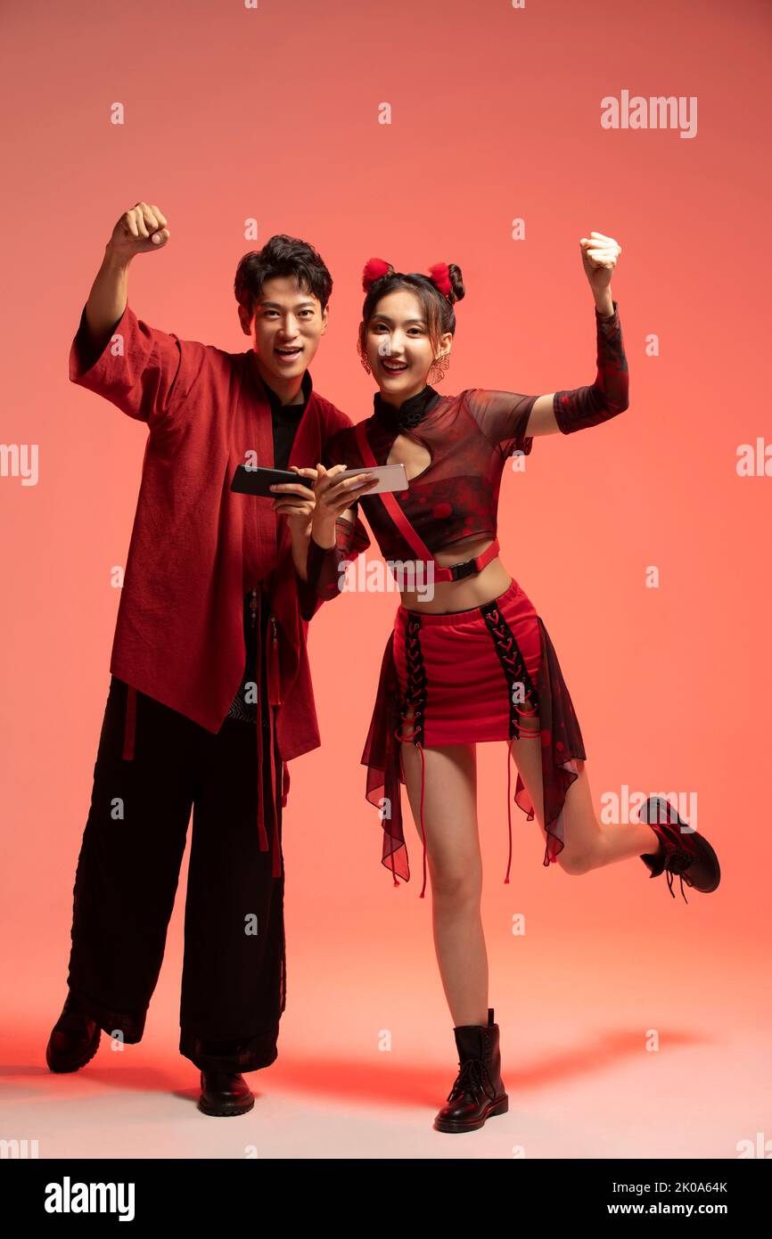 Young Chinese couple playing mobile games Stock Photo - Alamy