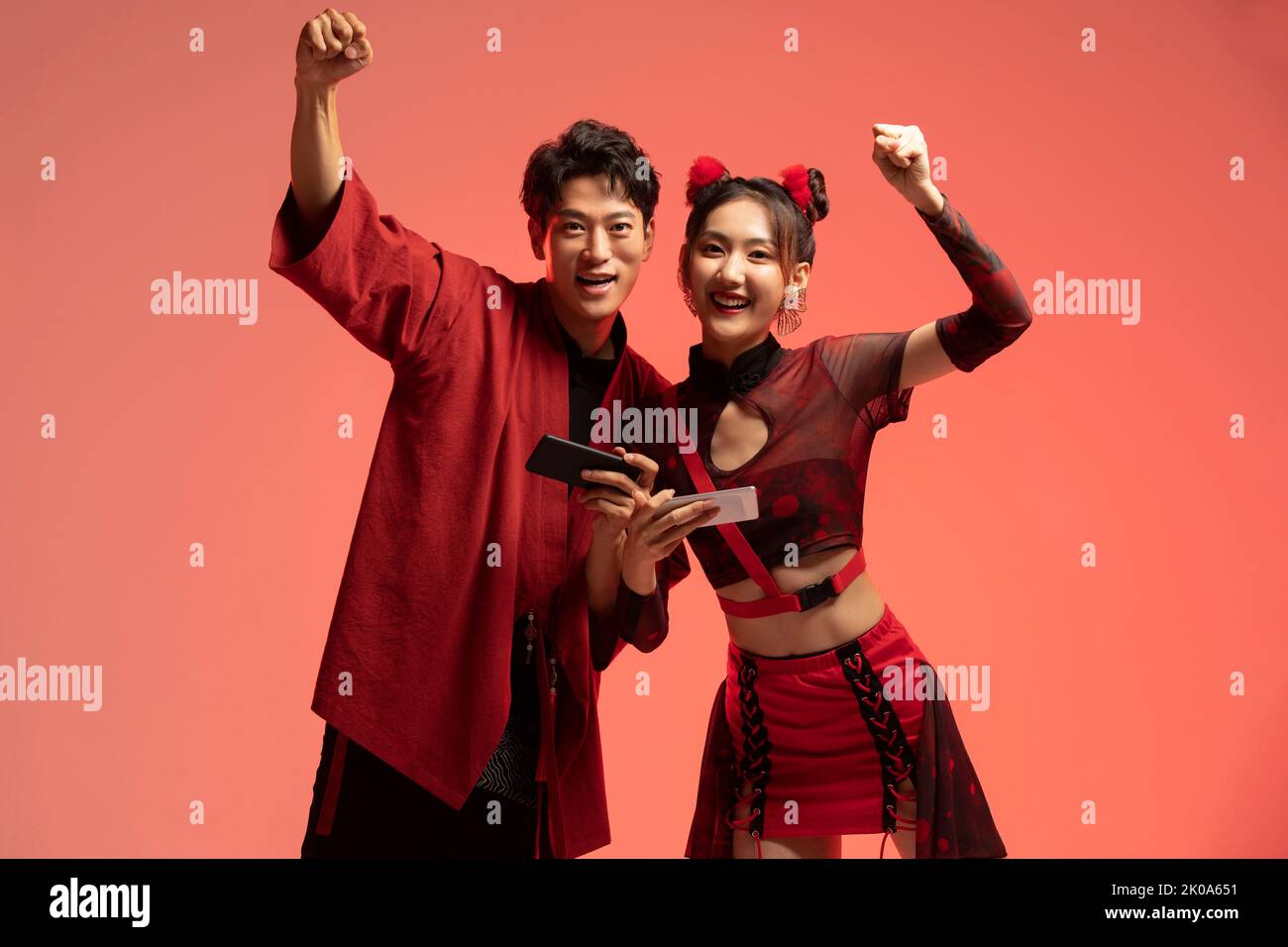 Young Chinese couple playing mobile games Stock Photo - Alamy