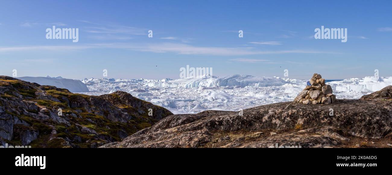 Rock cairn in landscape at Ilulissat Icefiord, Greenland. , a Unesco ...