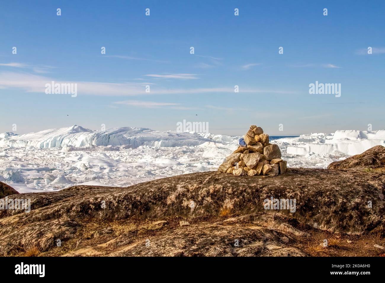 Rock cairn in landscape at Ilulissat Icefiord, Greenland. , a Unesco ...