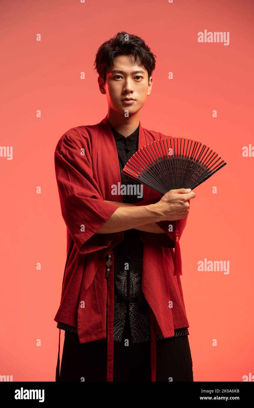 Portrait of confident young Chinese man Stock Photo - Alamy