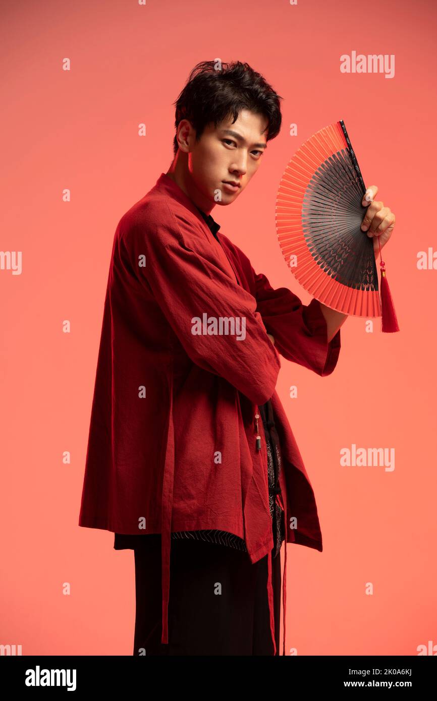 Portrait of confident young Chinese man Stock Photo - Alamy