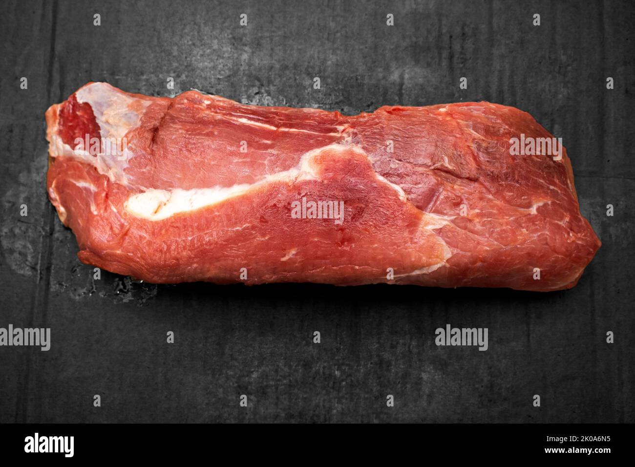 Top View of Fresh Raw Beef Thigh on Gray Cardboard Surface Stock Photo ...