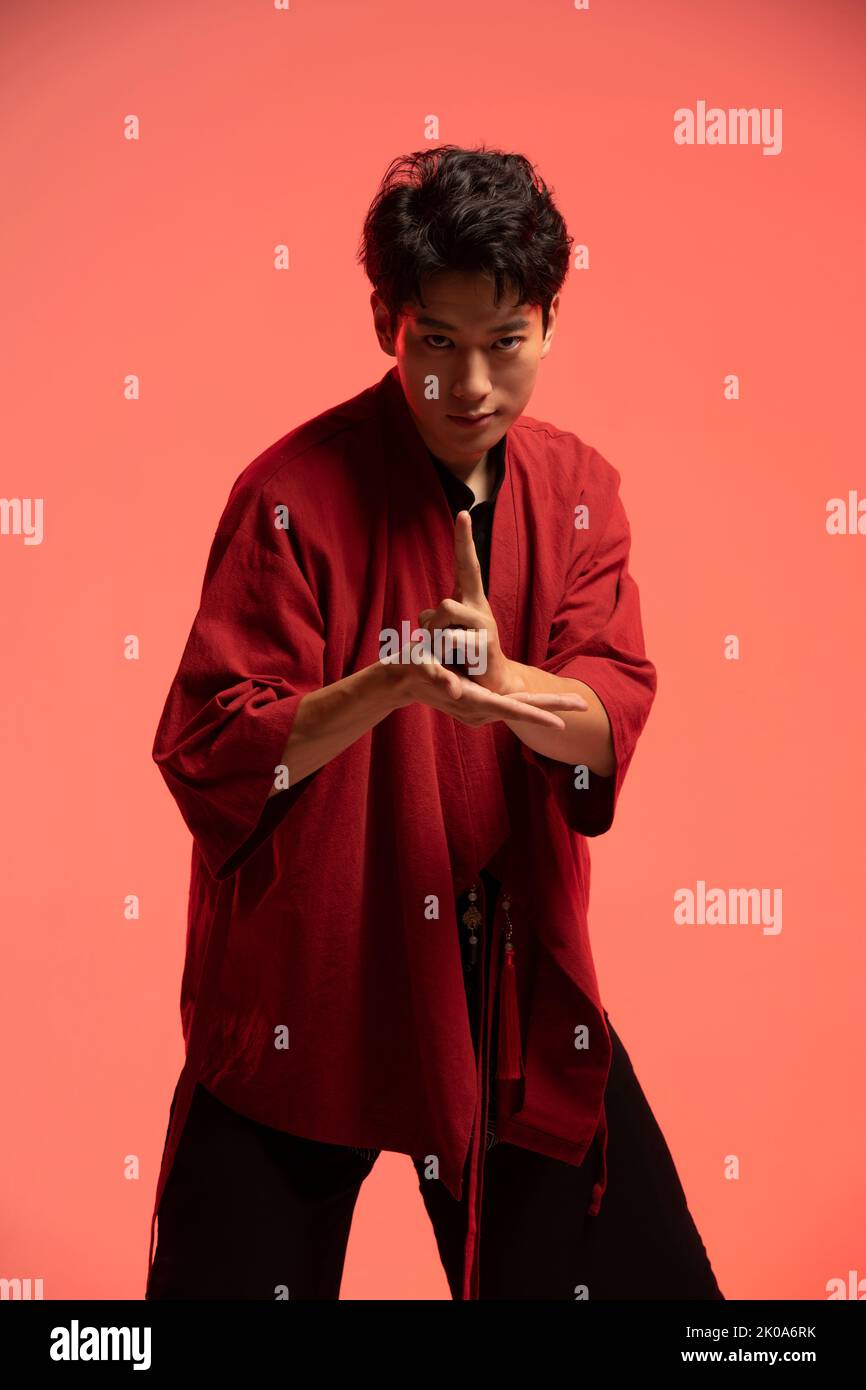 Portrait of confident young Chinese man Stock Photo - Alamy