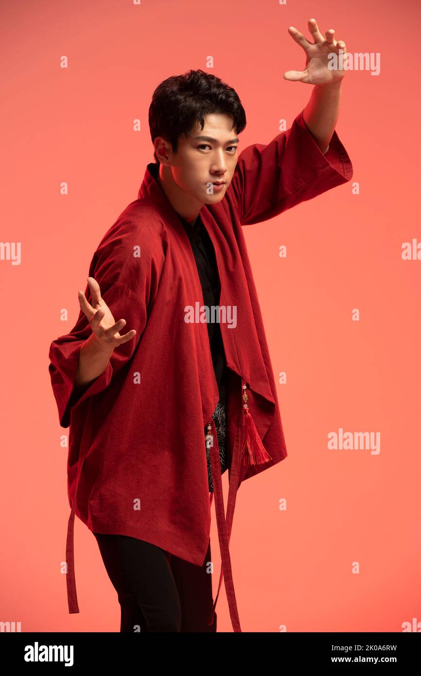 Portrait of confident young Chinese man Stock Photo - Alamy