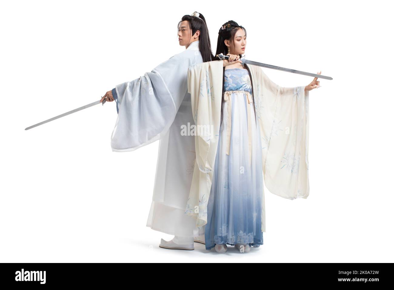 Young Chinese couple in ancient costume holding swords Stock Photo - Alamy