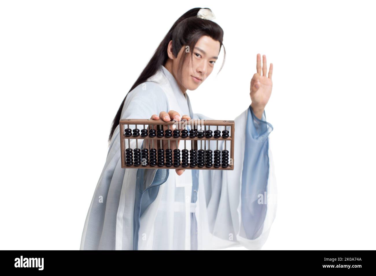 Young Chinese man in ancient costume holding an abacus Stock Photo - Alamy