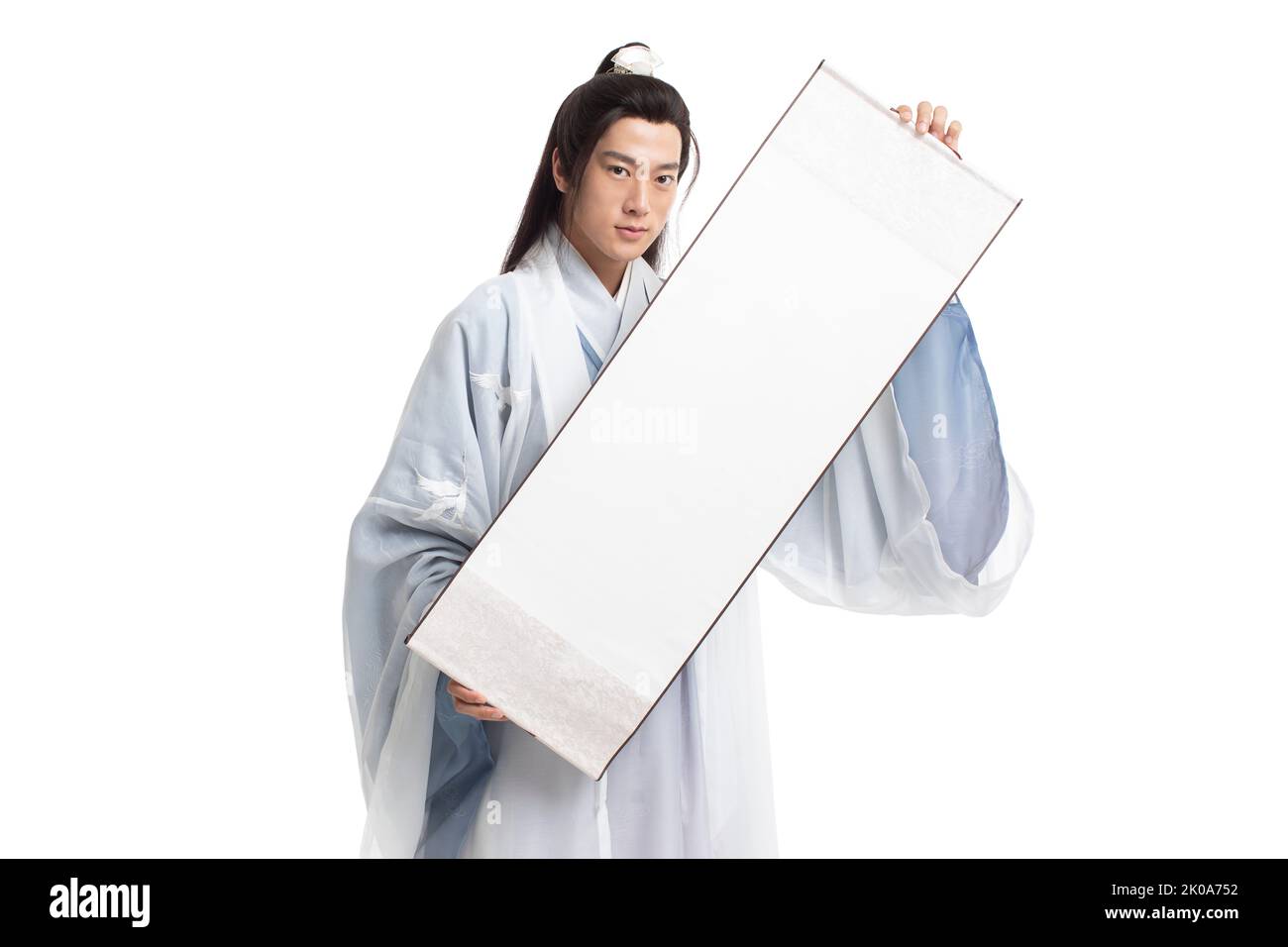 Young Chinese man in ancient costume holding a blank scroll Stock Photo ...