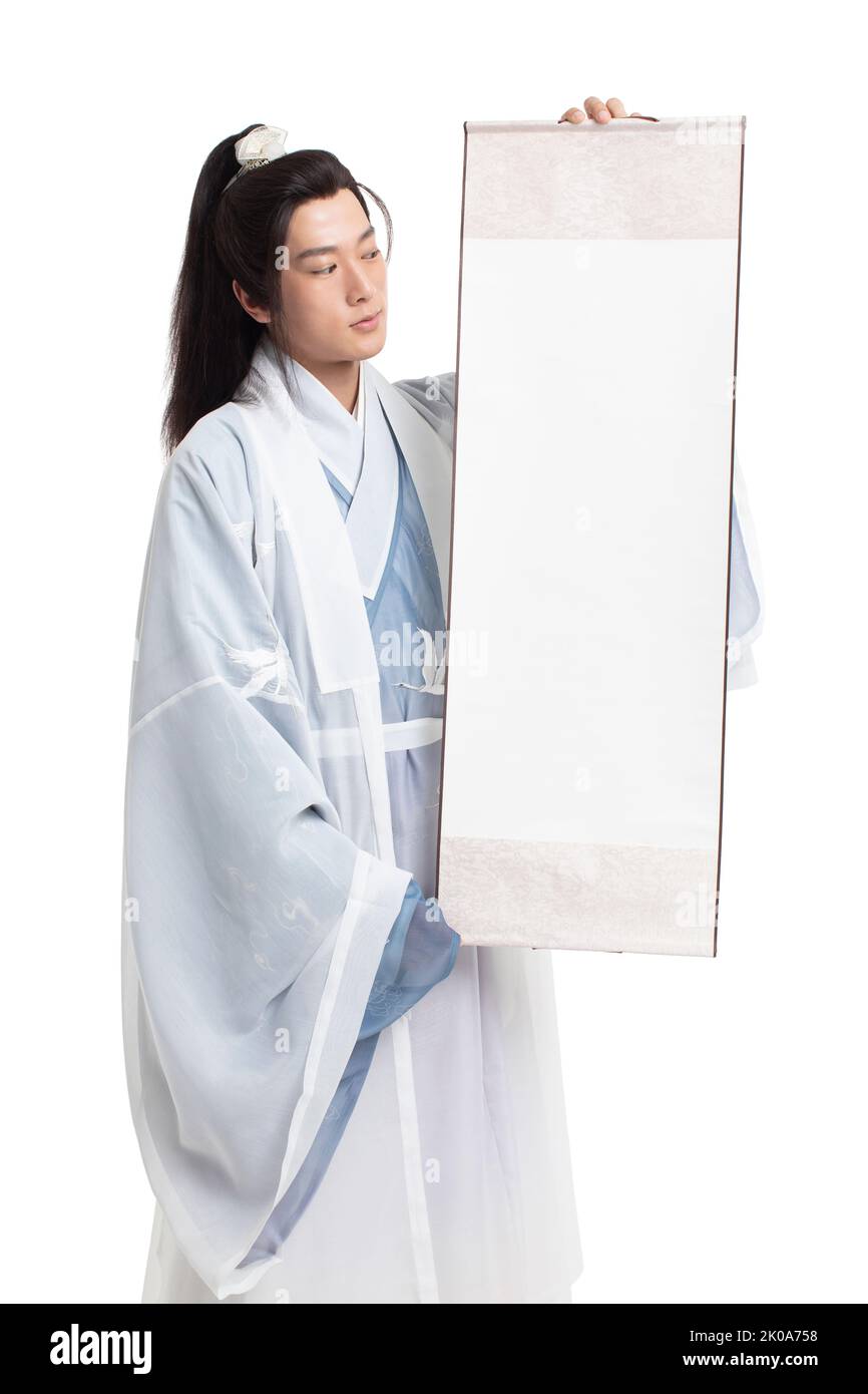 Young Chinese man in ancient costume holding a blank scroll Stock Photo ...
