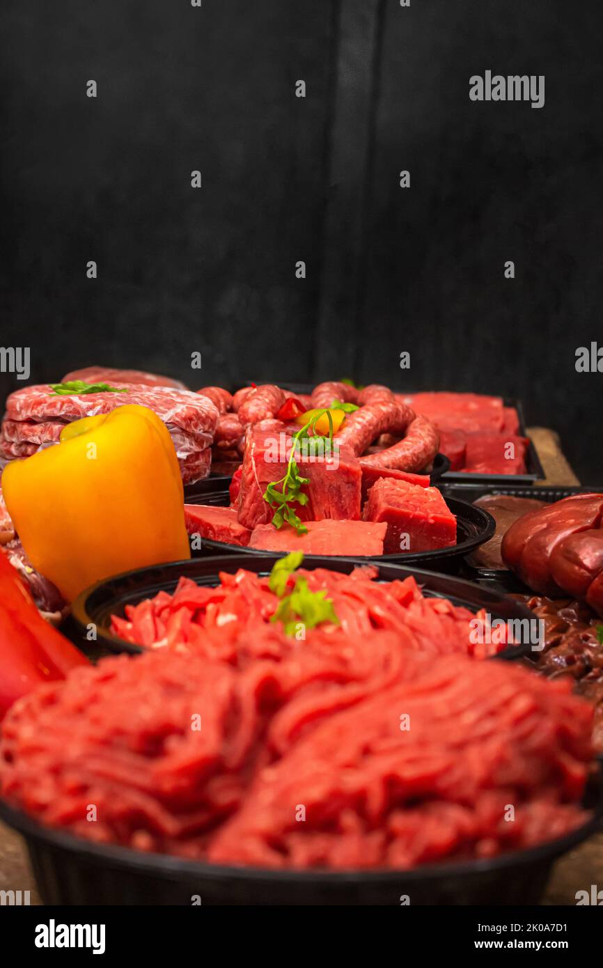 Assorted Raw Beef Meats with Dark Brick Wall Background Side View Stock ...
