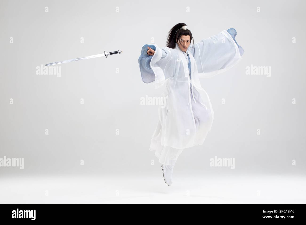 Young Chinese swordsman in ancient costume Stock Photo - Alamy