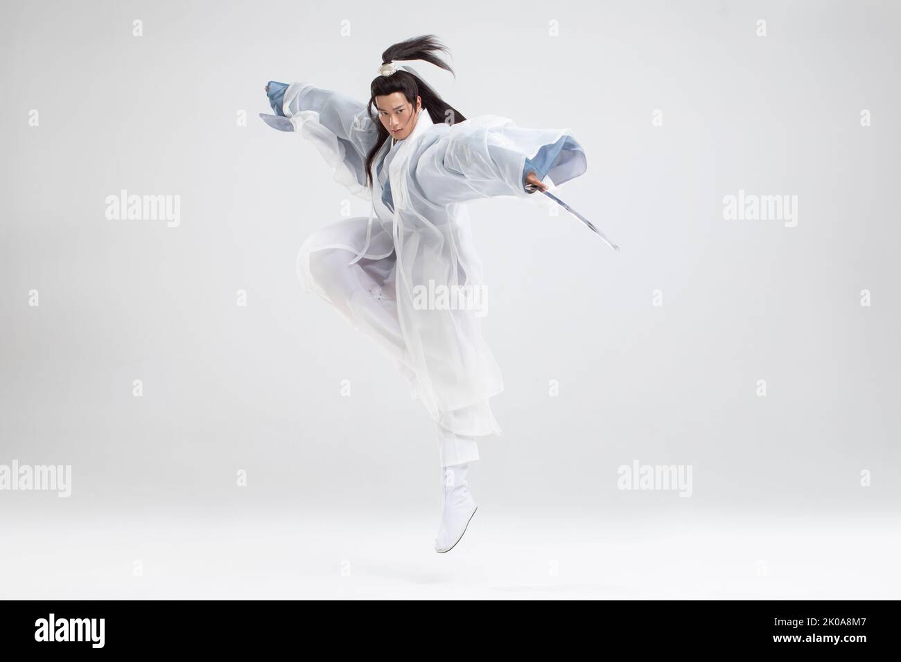 Young Chinese swordsman in ancient costume Stock Photo - Alamy