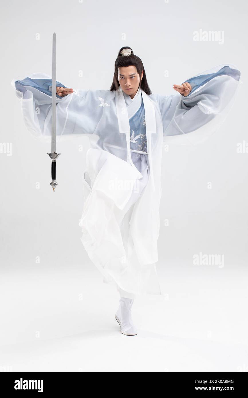 Young Chinese swordsman in ancient costume Stock Photo - Alamy
