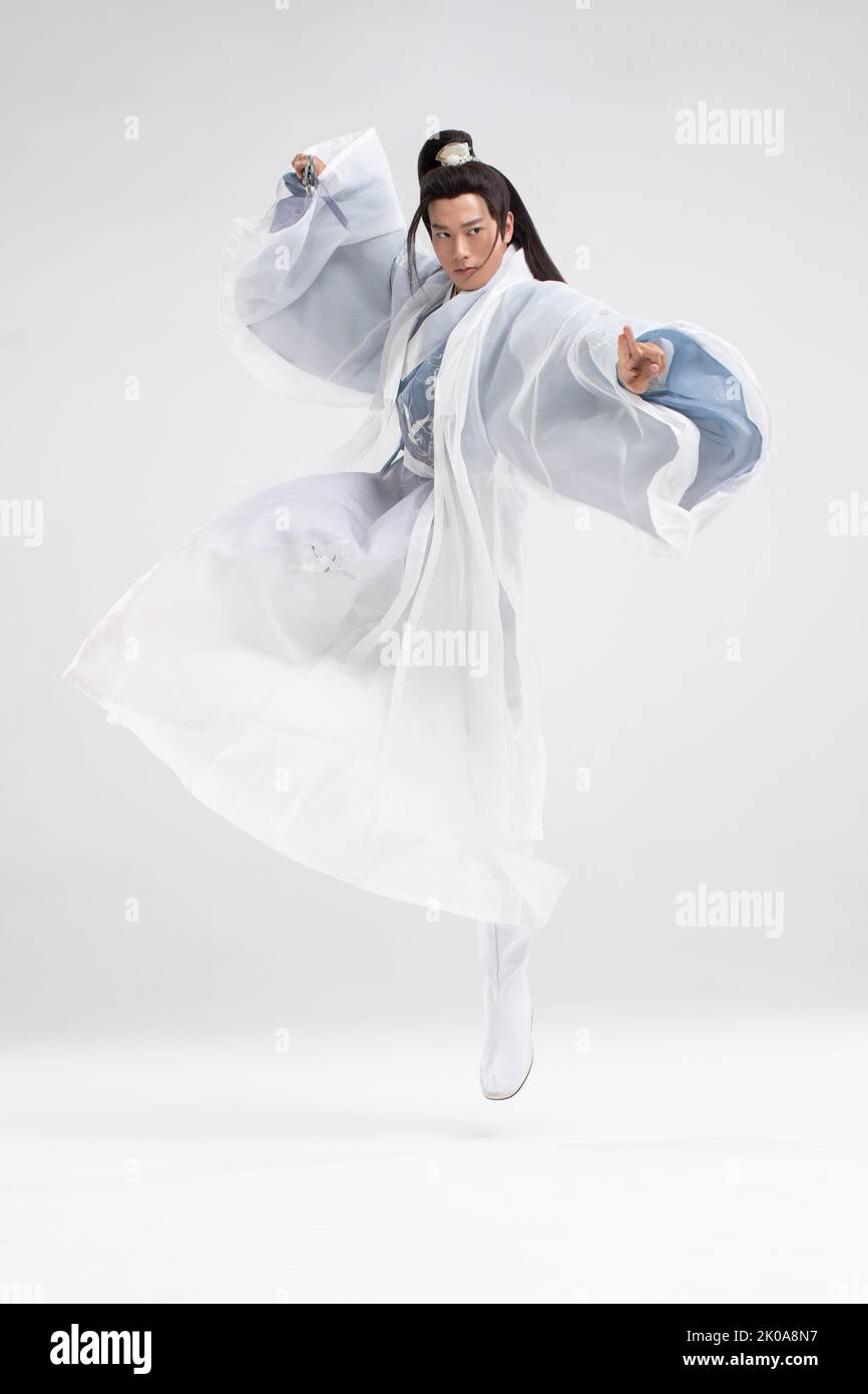 Young Chinese swordsman in ancient costume Stock Photo - Alamy