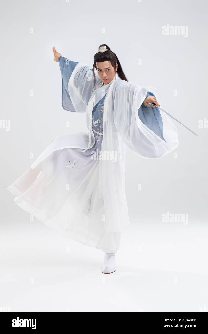 Young Chinese swordsman in ancient costume Stock Photo - Alamy