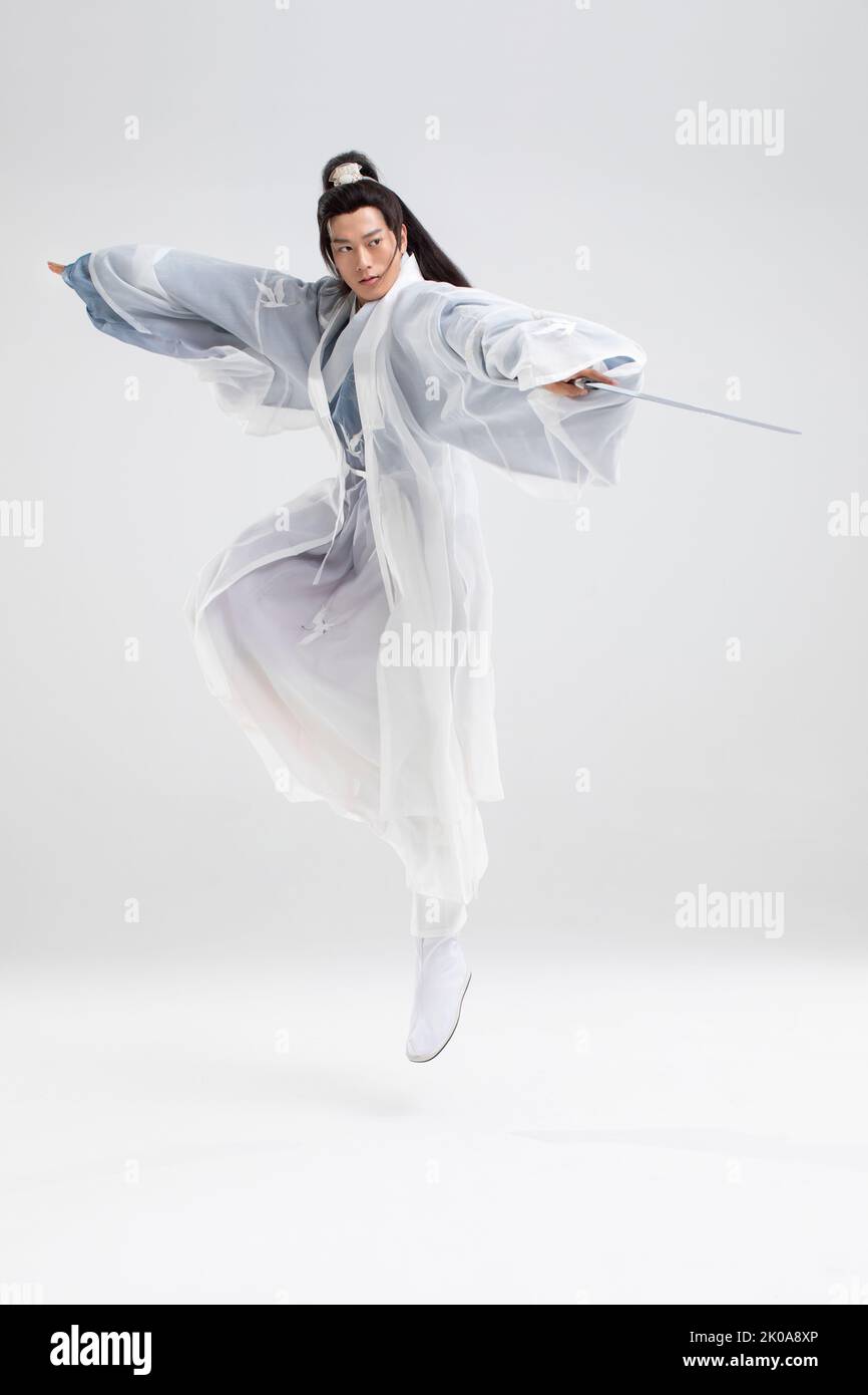 Young Chinese swordsman in ancient costume Stock Photo - Alamy